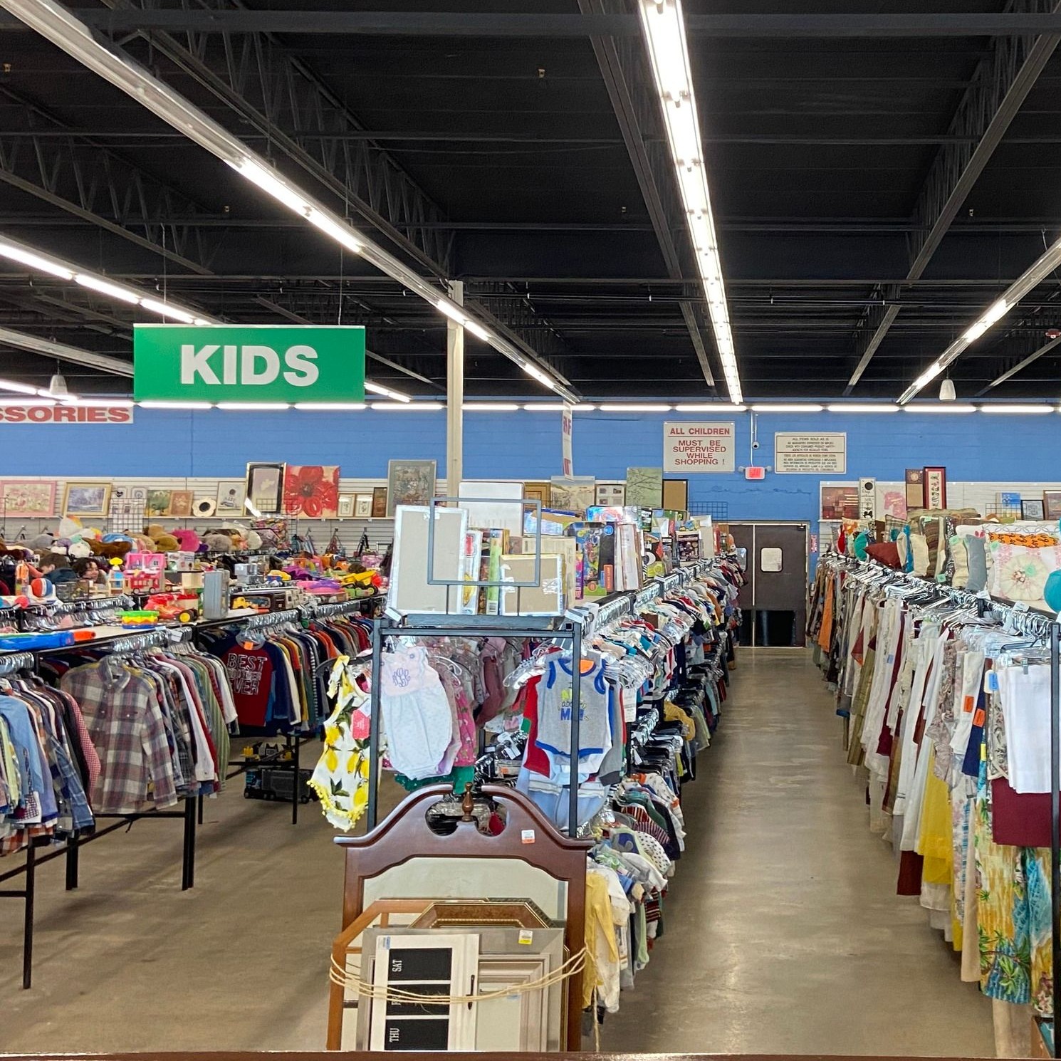 The children's department is organized chaos at its finest, where tiny treasures and pint-sized fashion await families looking to stretch their dollar further.
