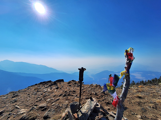 At Livingston Peak's summit, the prayer flags aren't just decorative&mdash;they're celebrating your achievement of climbing somewhere your car couldn't take you.