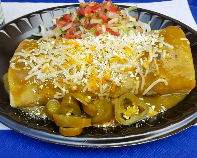 This enchilada isn't just covered in sauce&mdash;it's swimming in flavor, with melted cheese and jalape&ntilde;os standing by as willing lifeguards.