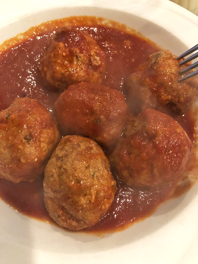 These meatballs aren't just swimming in sauce&mdash;they're taking a luxurious bath in it, soaking up flavor like they're at an Italian spa retreat.