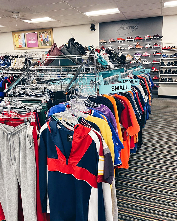 The menswear section: color-coded for efficiency. Because even second-hand shopping deserves a system that respects your time and sanity. P