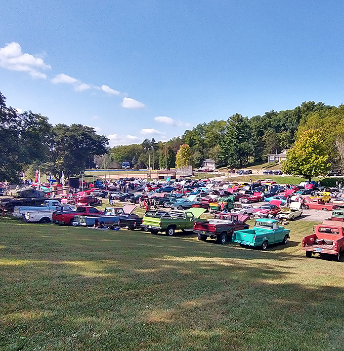 The annual car show transforms a simple field into a rainbow of automotive nostalgia – chrome gleaming under the Wisconsin sun.