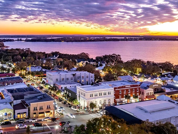 Sunset paints Mount Dora in golden hues as Lake Dora reflects the sky's masterpiece&mdash;proof that the best views sometimes come from the places least expected.