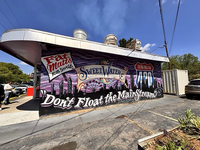 This mural isn't just wall art—it's a love letter to Atlanta's culture that says "don't float the mainstream" while serving mainstream-worthy barbecue.