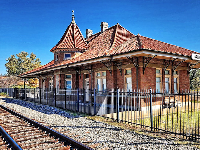 The Nacogdoches Railroad Depot stands as an architectural gem with its distinctive turret and terra cotta roof&mdash;a reminder of travel's golden age.