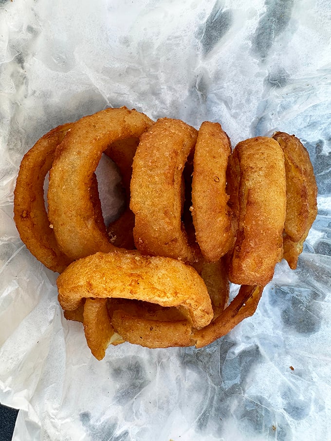 Onion rings with the perfect crunch-to-give ratio. Each golden circle is a reminder that the simple pleasures endure.