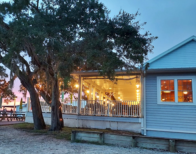 Twilight transforms Aunt Kate's into a glowing beacon of seafood excellence. Those porch lights aren't just illumination&mdash;they're a siren call to hungry travelers.