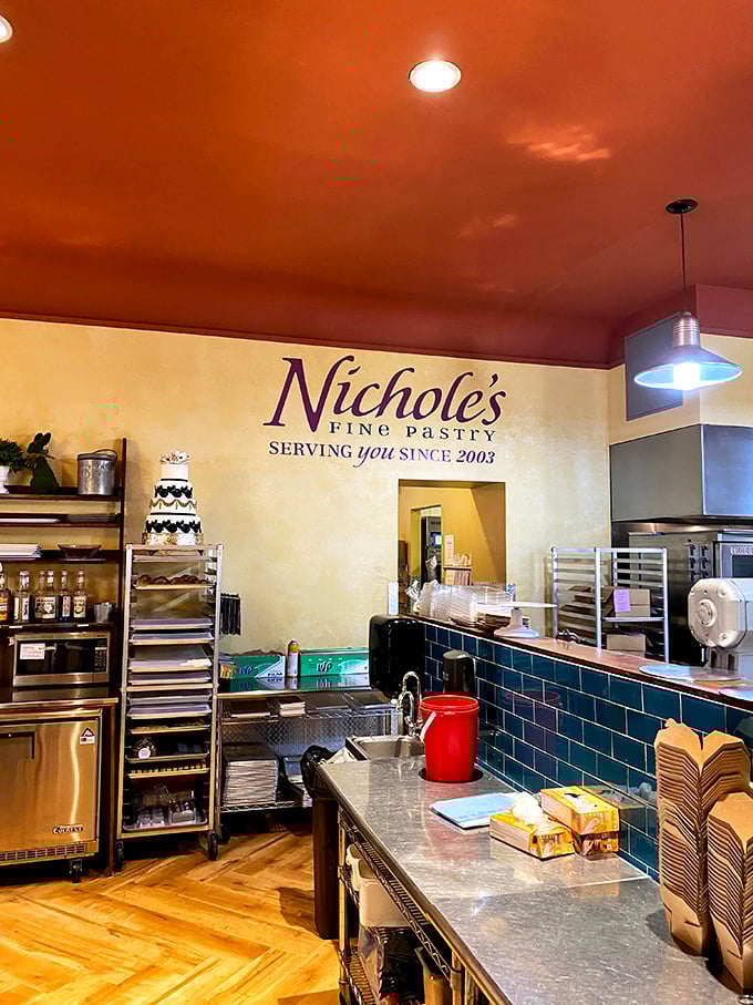 A glimpse into the inner sanctum where flour becomes art. That terra cotta ceiling and blue tile backsplash are as carefully crafted as the pastries themselves.