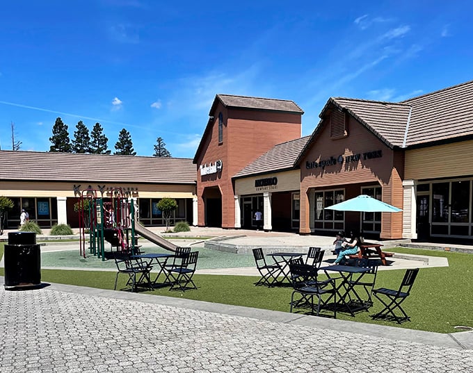 Between shopping sprees, this outdoor oasis offers respite for weary wallets and tired feet—plus playground equipment to bribe the grandkids.