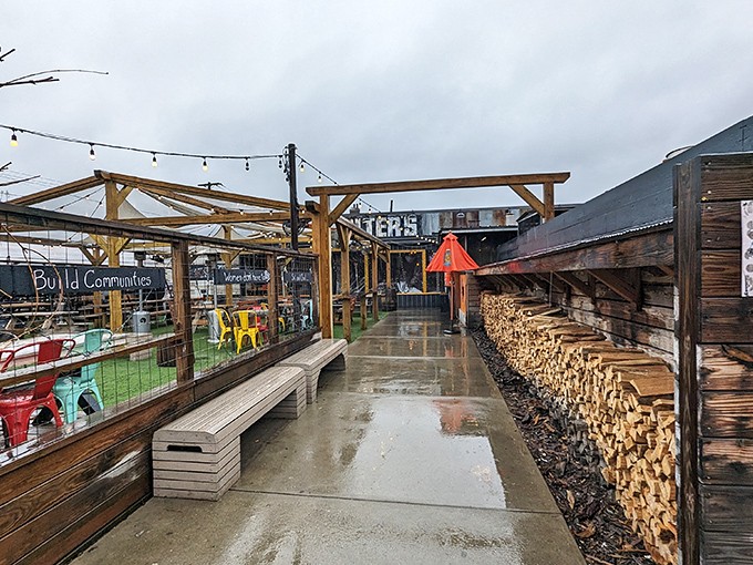 Rain or shine, the covered patio with stacked firewood nearby reminds you that good barbecue waits for no one.
