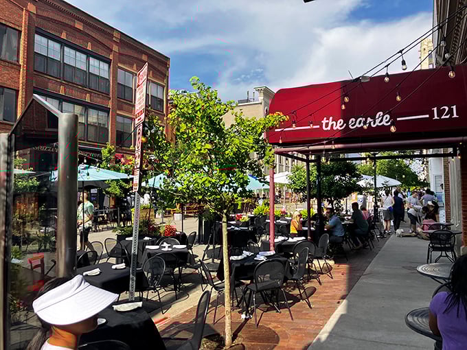 Summer brings al fresco dining under the red awning&mdash;Michigan sunshine and European flavors in perfect harmony.