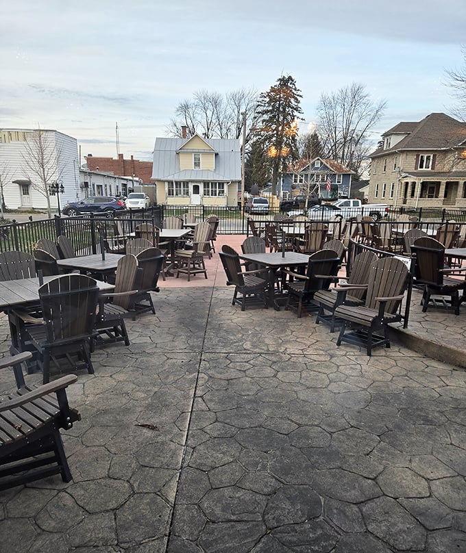 The outdoor patio offers fresh air dining with Adirondack chairs perfect for post-meal relaxation. Summer evenings were made for this.
