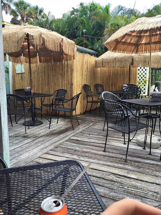 Tiki paradise on a wooden deck. The outdoor seating area offers shaded tables under thatched umbrellas&mdash;the perfect spot to savor your Cuban sandwich.