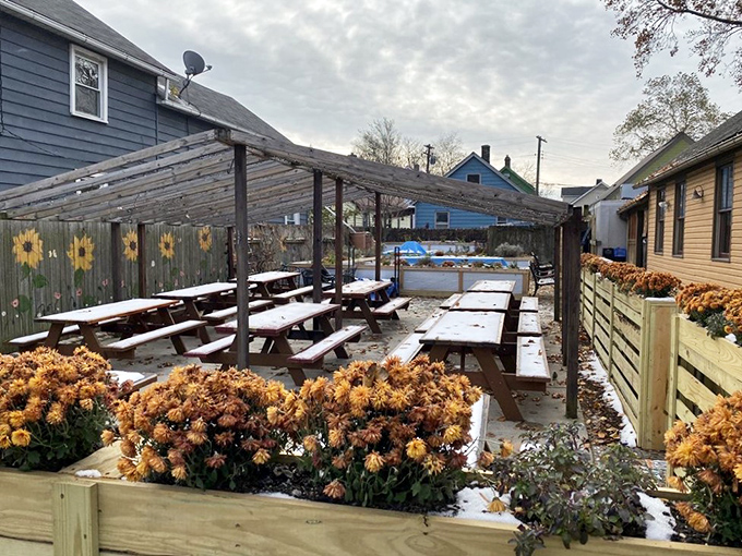 The garden patio, dusted with snow, hints at warmer days when herbs and vegetables grow here, eventually making their way to your plate.