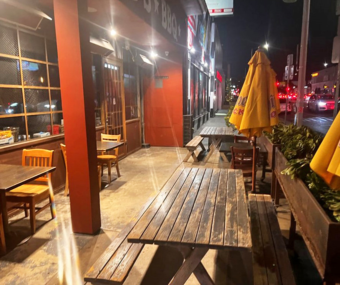 As night falls, the outdoor seating at Bludso's becomes an urban oasis where the only thing better than the barbecue is enjoying it under the stars.