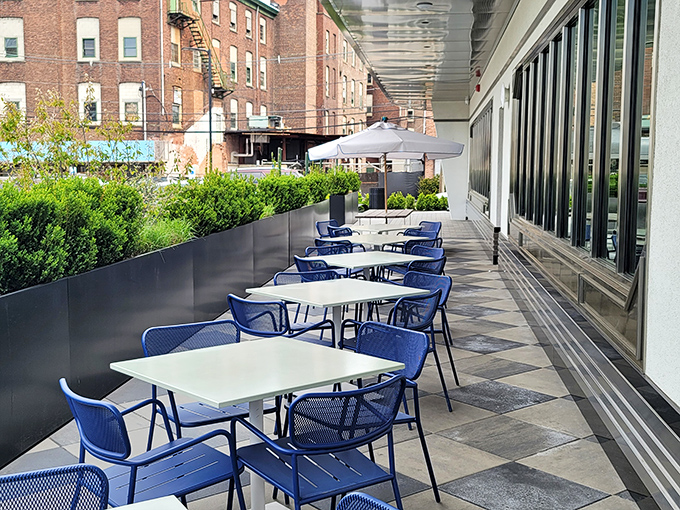 The exterior landscaping adds a touch of refinement&mdash;proving that at Tops, even the flowers outside dress up for dinner.