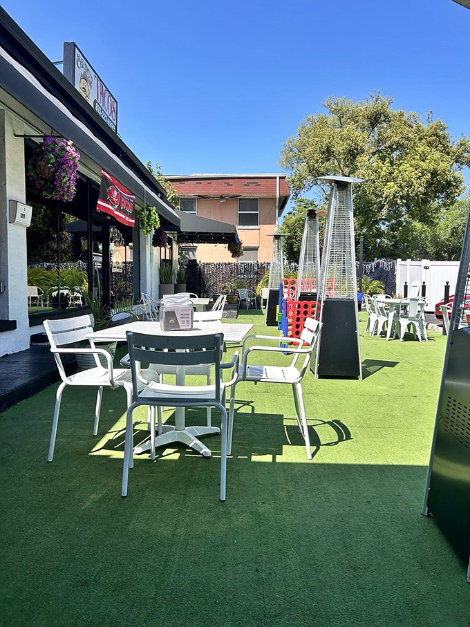 The outdoor seating area offers a green oasis in urban Tampa, where sandwich enthusiasts gather like members of a delicious, secret society.