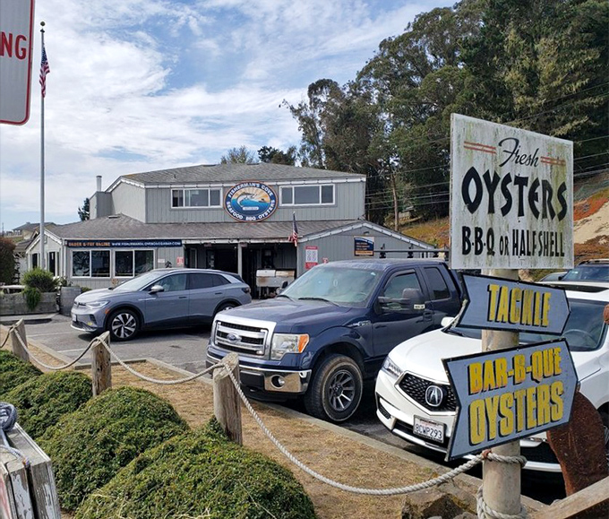 Signs promising fresh oysters and BBQ aren't just advertising—they're a coastal promise that's kept with every delicious bite served.