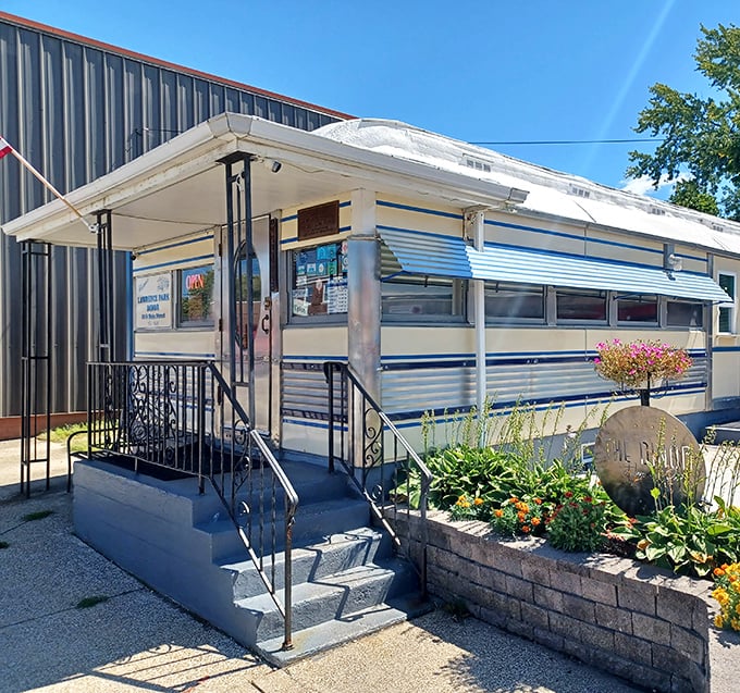 The welcoming entrance complete with flowers and American flag, inviting you inside for breakfast done the old-fashioned way.