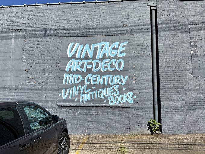 The outdoor mural beckons treasure hunters inside, where mid-century dreams and antique schemes await your discovery.