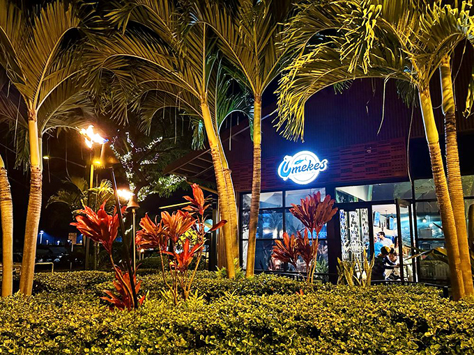 As night falls, Umekes transforms into a glowing beacon of culinary delight &ndash; palm trees illuminated like nature's own dinner invitation.