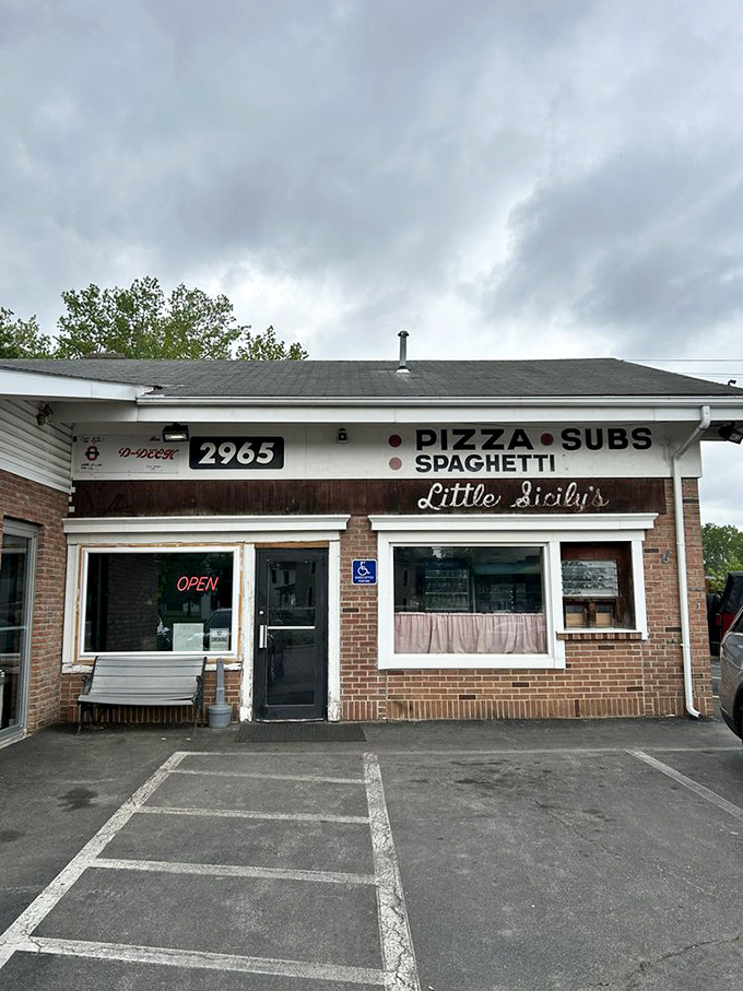 Rain or shine, this humble building beckons hungry Ohioans with its simple promise: come in, sit down, and prepare for pizza perfection.
