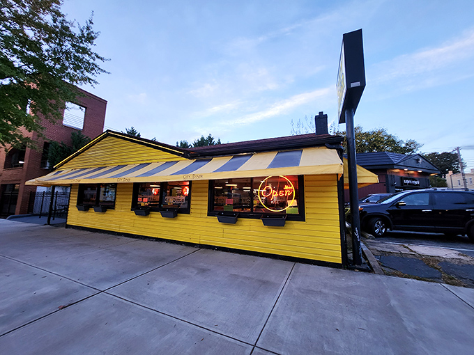 As evening approaches, City Diner's bright yellow exterior glows like a lighthouse guiding hungry souls to harbor.