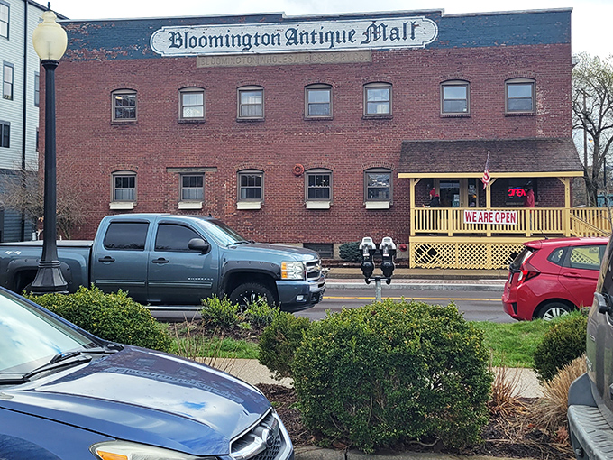 The exterior view reveals the mall's brick charm. That yellow porch isn't just an entrance&mdash;it's the gateway to your next great find.