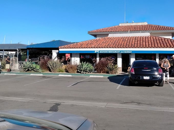 The parking lot view that signals you've arrived at seafood paradise. That blue trim and terra cotta roof become beacons for hungry travelers.