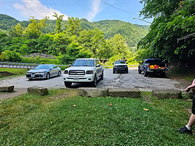 The humble parking area that serves as the gateway to wonder. Your chariot awaits its return while you commune with geological magnificence.