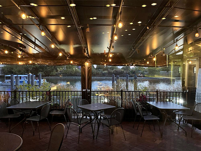 As twilight descends, the riverfront patio becomes Delaware's answer to coastal dining &ndash; string lights twinkling above as the Christina River flows gently by.