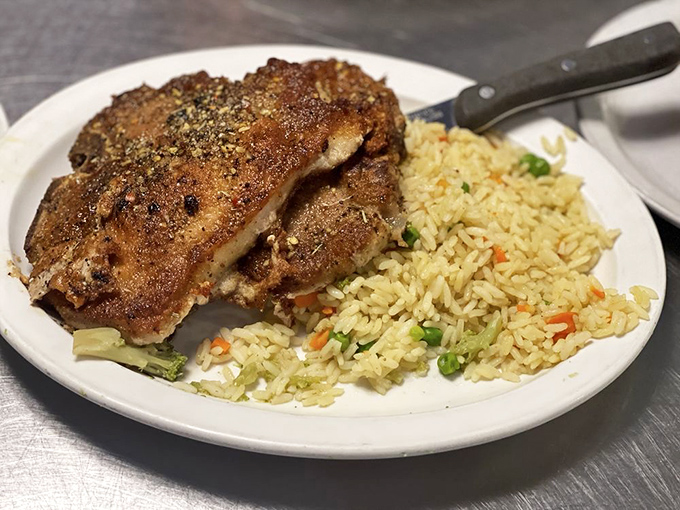 A pork chop that doesn't need white tablecloths to prove its worth&mdash;just rice pilaf and the satisfied silence that follows that first perfect bite.