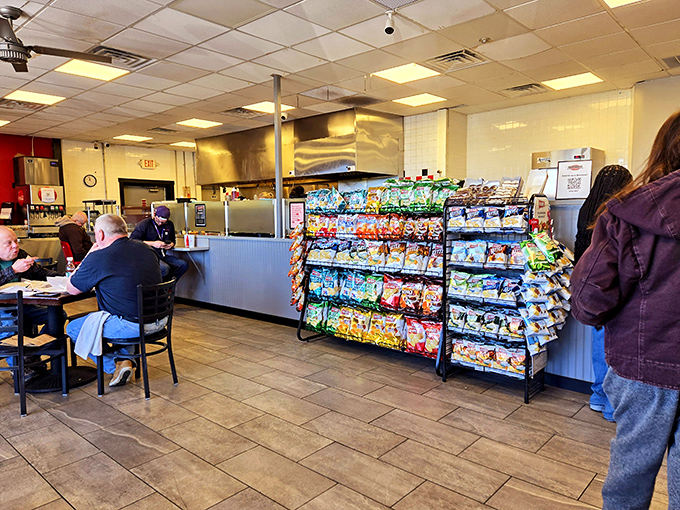 Even with chip racks and dining tables in view, all eyes are on the kitchen &ndash; the source of the aromas driving everyone slightly mad with hunger.