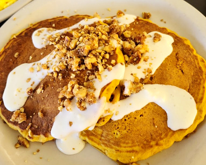 Pumpkin pancakes topped with what can only be described as autumn in edible form. Crunchy walnuts and cream creating a breakfast worth waking up for.