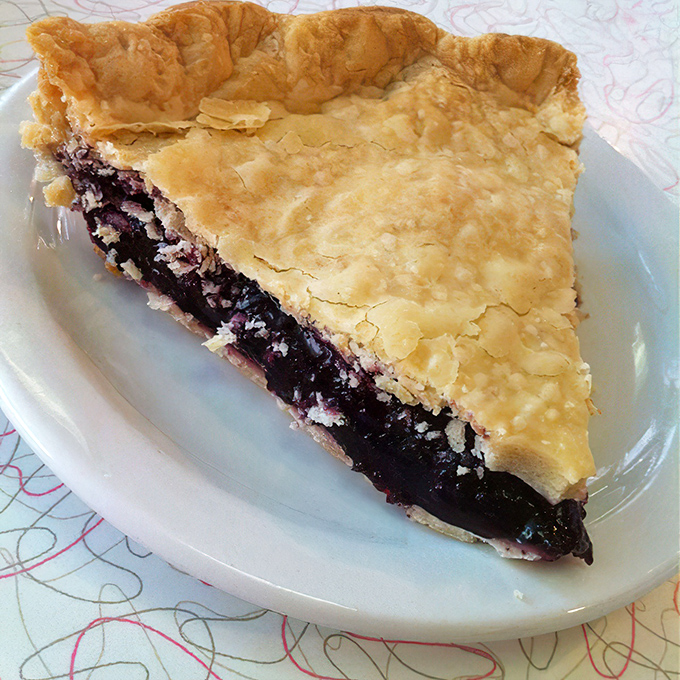 This berry pie's flaky crust barely contains its deep purple treasure. One bite and you'll understand why pie is America's most nostalgic dessert.