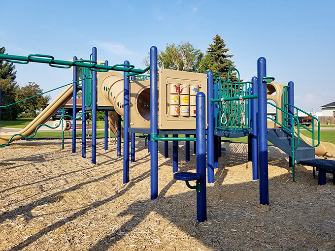 Childhood joy engineered in primary colors. This playground has witnessed generations of first climbs, brave slides, and parental heart-stopping moments.