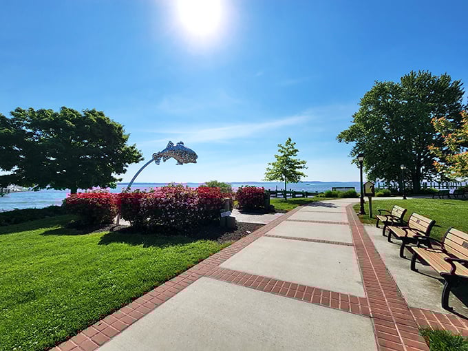 Vibrant flowers frame a waterfront path that practically demands leisurely strolling. That fish sculpture seems to be jumping for joy&mdash;exactly how you'll feel here.