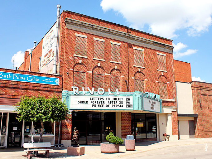 The historic Rivoli Theater marquee promises entertainment at prices that won't make you choke on your popcorn. Retirement never looked so classically cool.