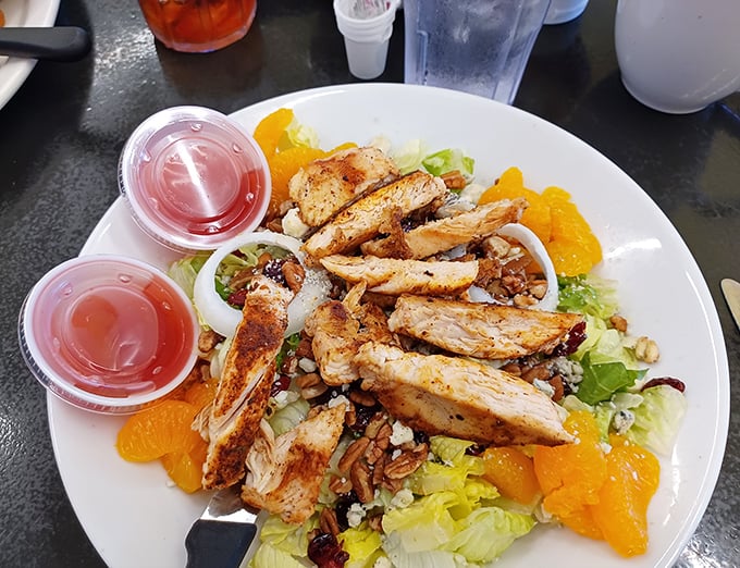A salad that proves healthy eating doesn't have to be punishment&mdash;grilled chicken, mandarin oranges, and what appears to be candied nuts.