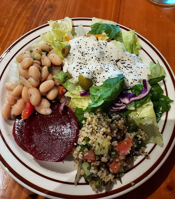 A plate that proves The Steak Inn isn't just about meat – their salads and sides show the same care and attention as their steaks.