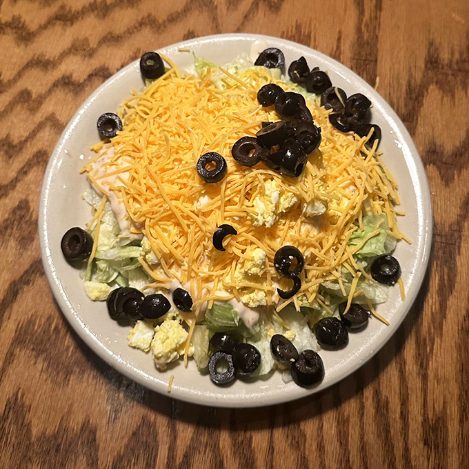 A simple salad becomes something special here—the perfect opening act before the headlining steak performance.