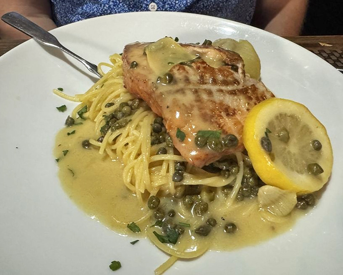 Salmon piccata proves the versatility of this classic preparation. The fish practically lounges in its lemony-caper bath like it's at a luxury spa.
