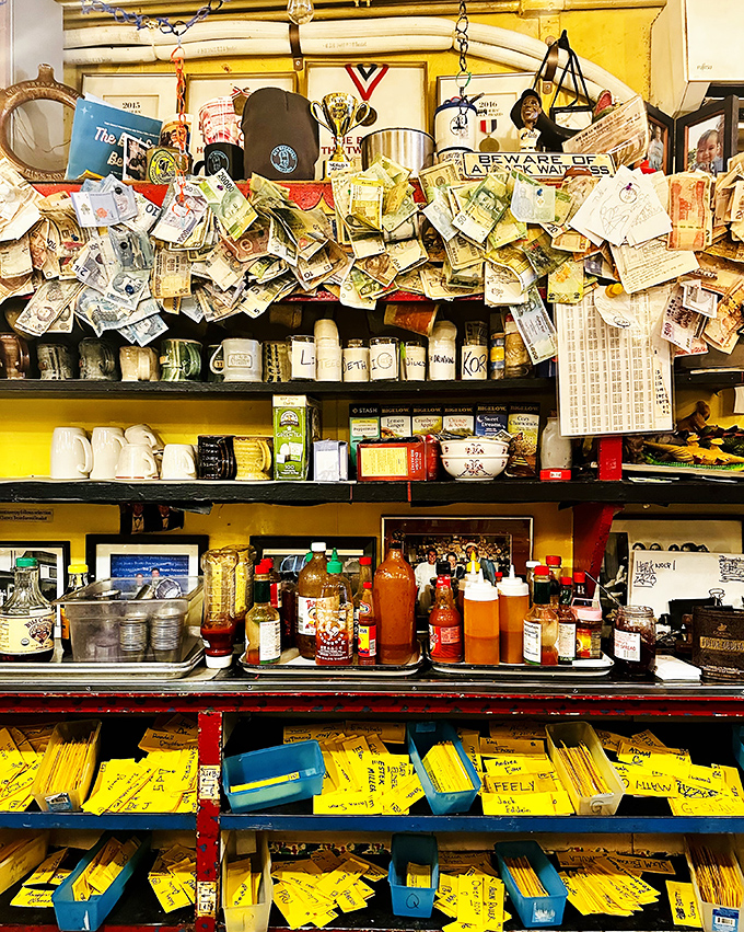 The wall of dollar bills and notes isn't just decoration&mdash;it's a physical manifestation of decades of customer gratitude for perfect pancakes.