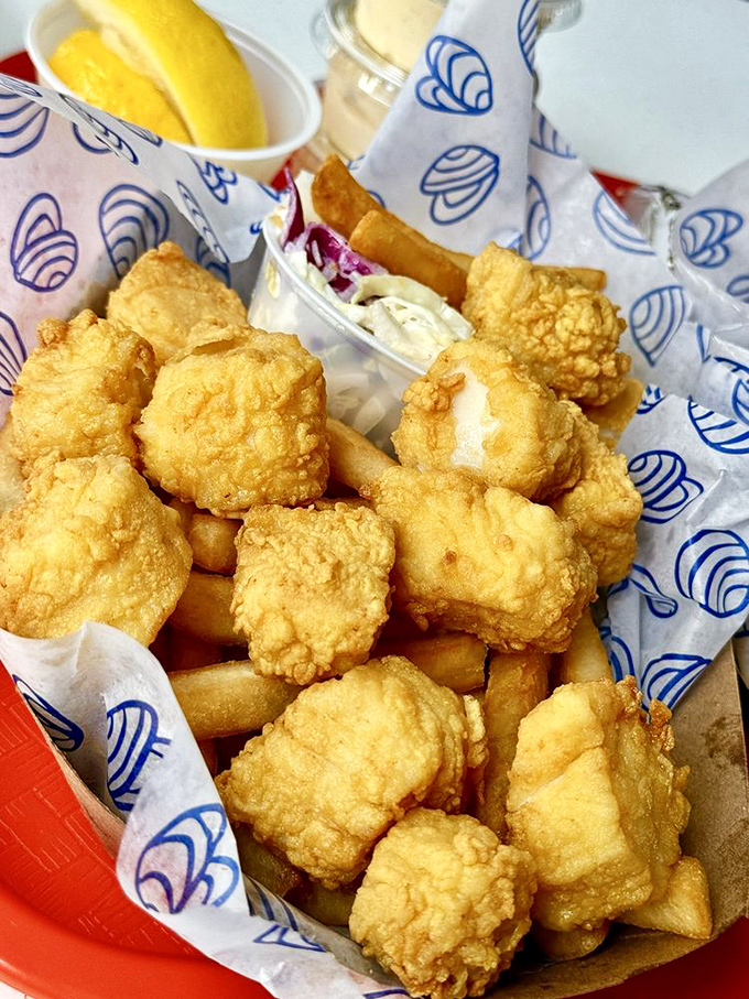 Golden nuggets of the sea. These perfectly fried scallops, sweet inside and crispy outside, might just steal the spotlight from the famous clams.