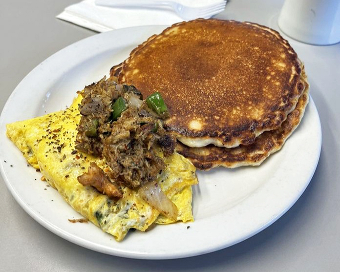 Seafood omelet meets pancakes in a breakfast power couple that would make any morning memorable.