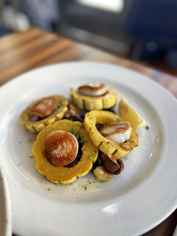 Seared scallops nestled in delicata squash&mdash;a plate so beautiful it's almost a shame to eat it. Almost.
