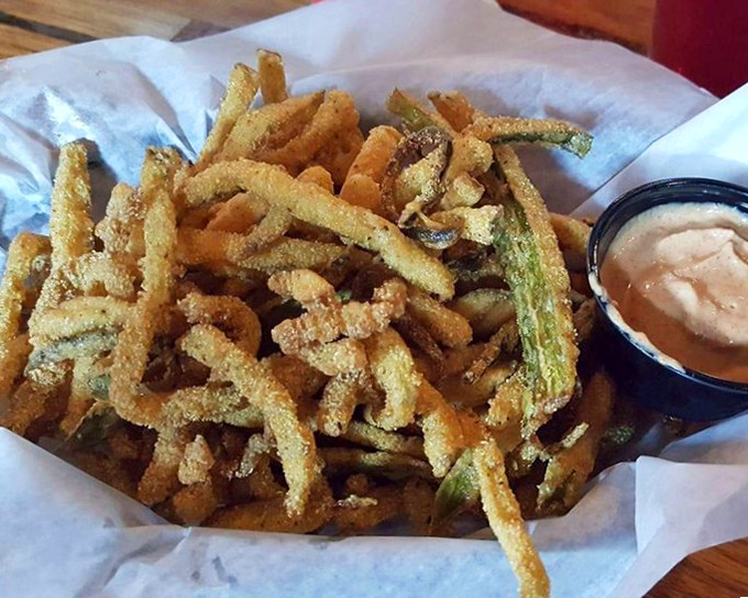 Pickle fries that deliver the perfect crunch-to-tang ratio. These crispy, golden green strips provide a welcome acidic counterpoint to the richness of the main attractions.