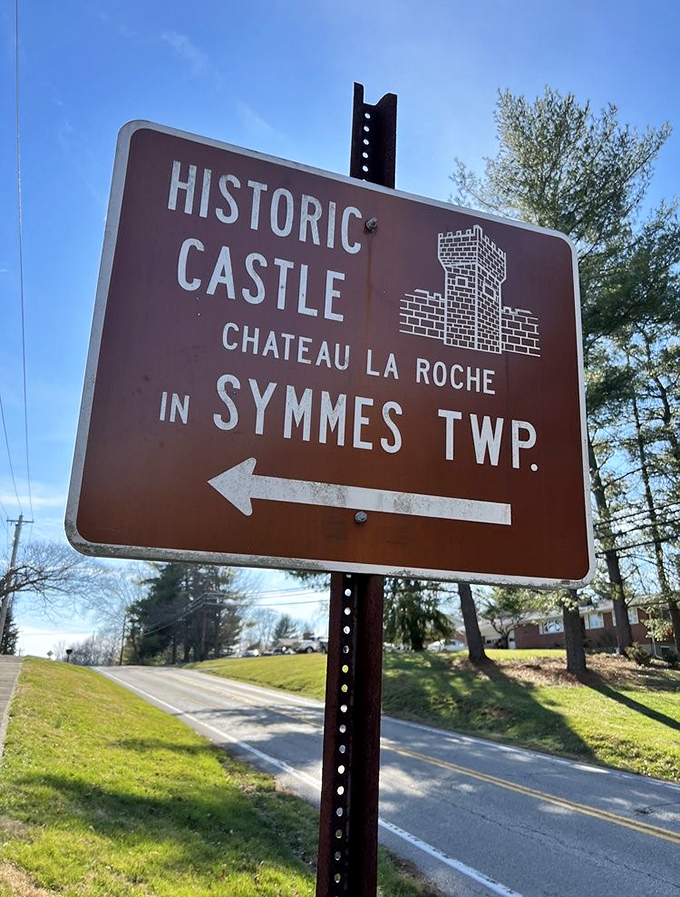 Brown highway signs: the modern-day equivalent of treasure maps, leading adventurers to unexpected wonders like Chateau Laroche.