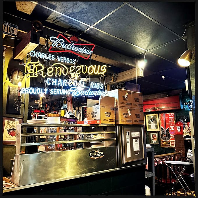 That neon sign promises two essential elements of happiness: Rendezvous ribs and cold beer. A beacon of hope in a hungry world.