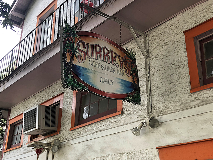 The vintage-style hanging sign beckons hungry passersby like a lighthouse guiding breakfast-seekers safely to shore.